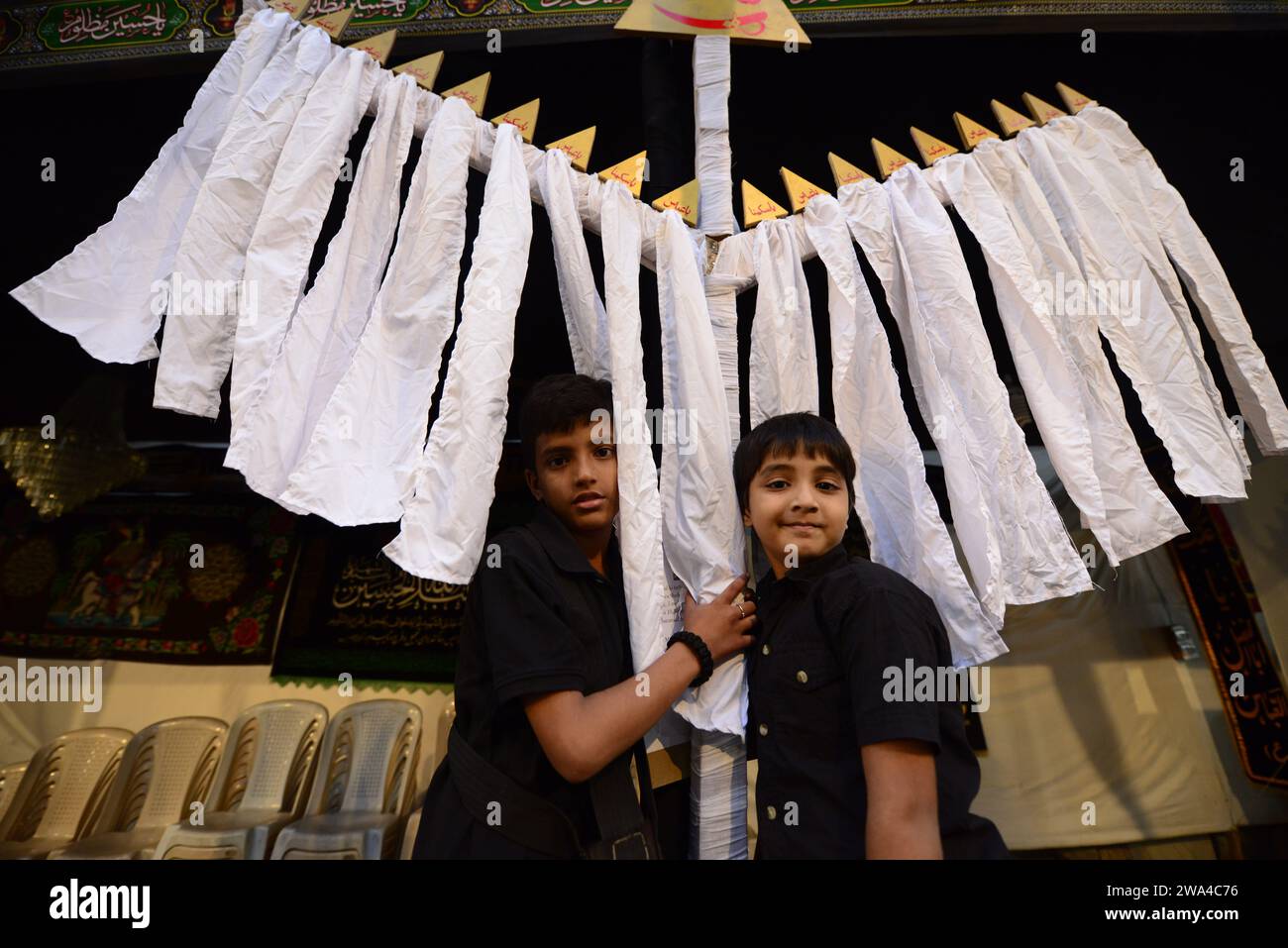 Indian Shia boys posing for a picture during the Muharram holy month ...
