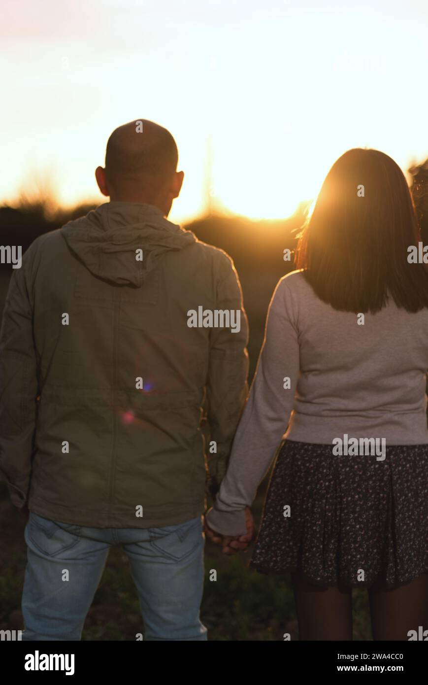 Love story couple sunset on hi-res stock photography and images - Alamy