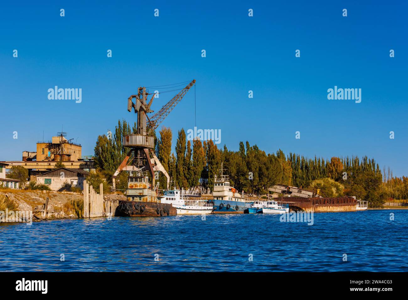 old abandoned soviet Port Balykchy on Issyk-Kul lake at sunny autumn ...