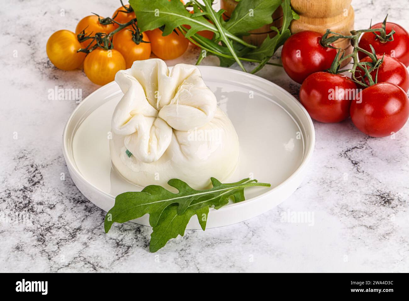 Creamy Italian traditional Burrata cheese served tomato and rucola ...