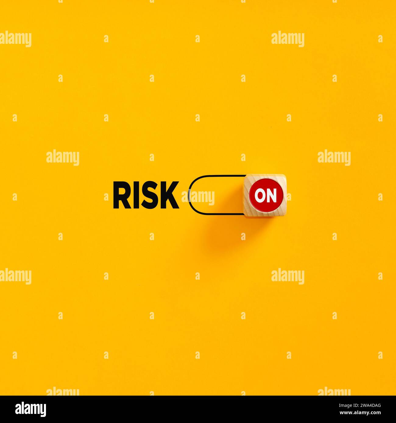 Risk on slider button on yellow background. Risk taking or risk ...