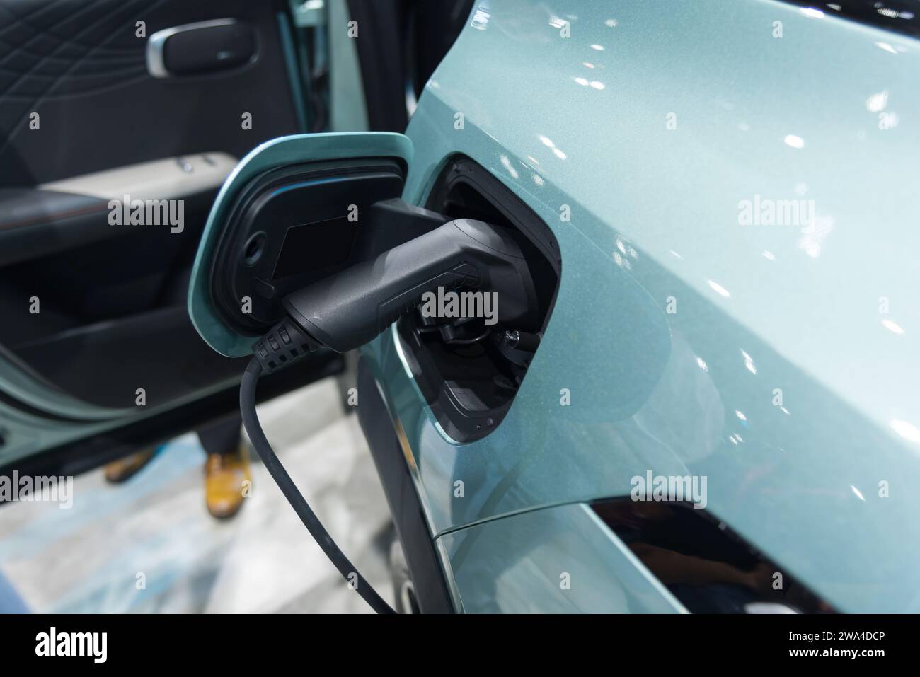 Connect the EV plug for charging the EV car Stock Photo - Alamy