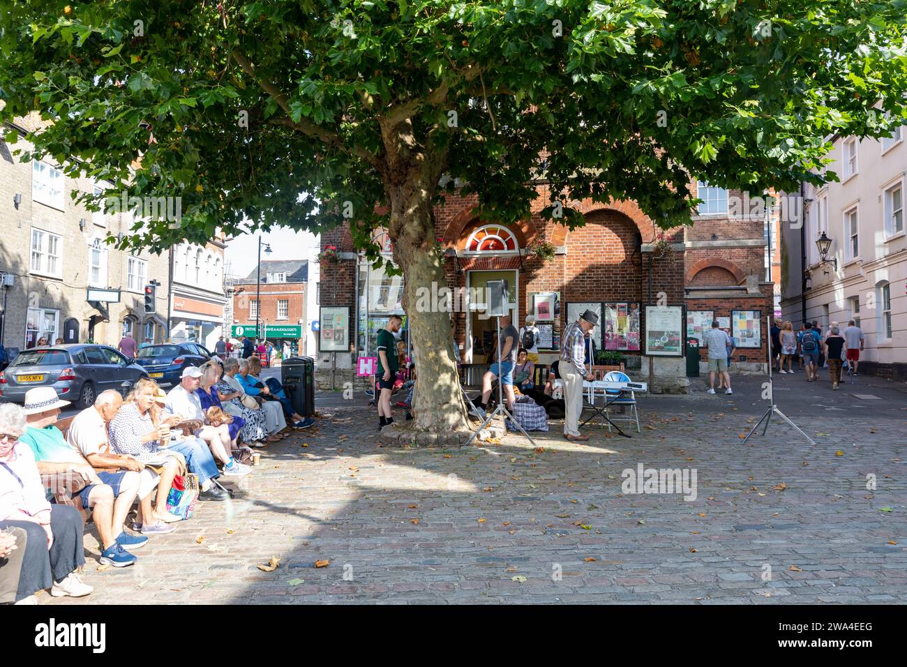 Bridport Dorset, hot sunny September day 2023 and locals rest on market ...