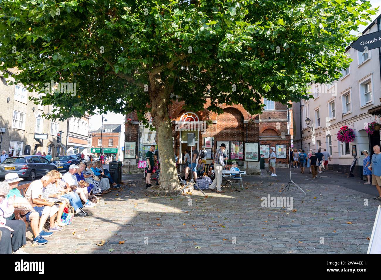 Bridport Dorset, hot sunny September day 2023 and locals rest on market ...