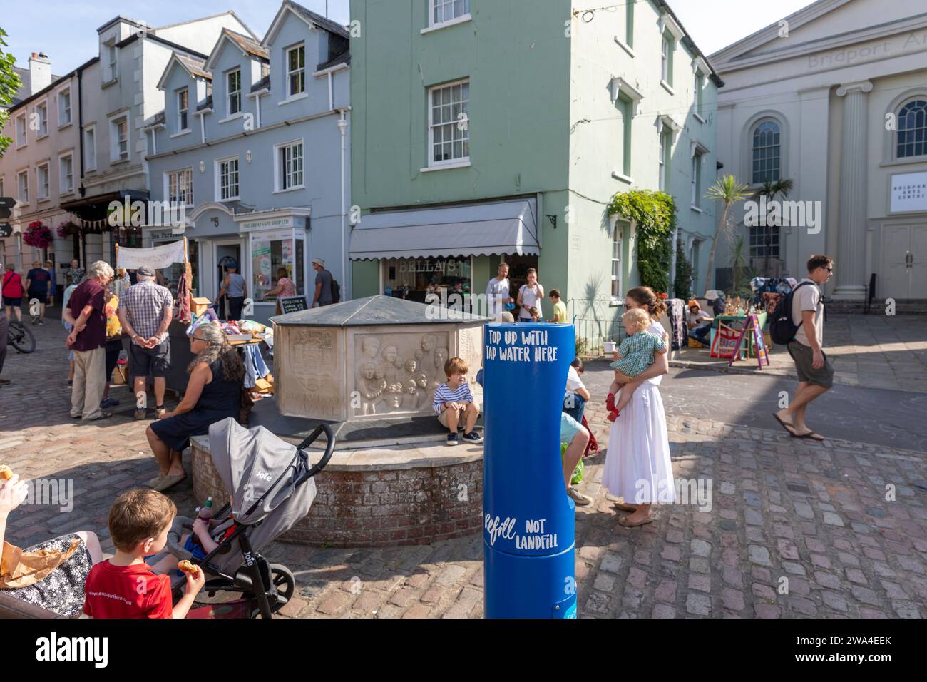 Bridport Dorset, people taking a break in Bucky Doo square during ...