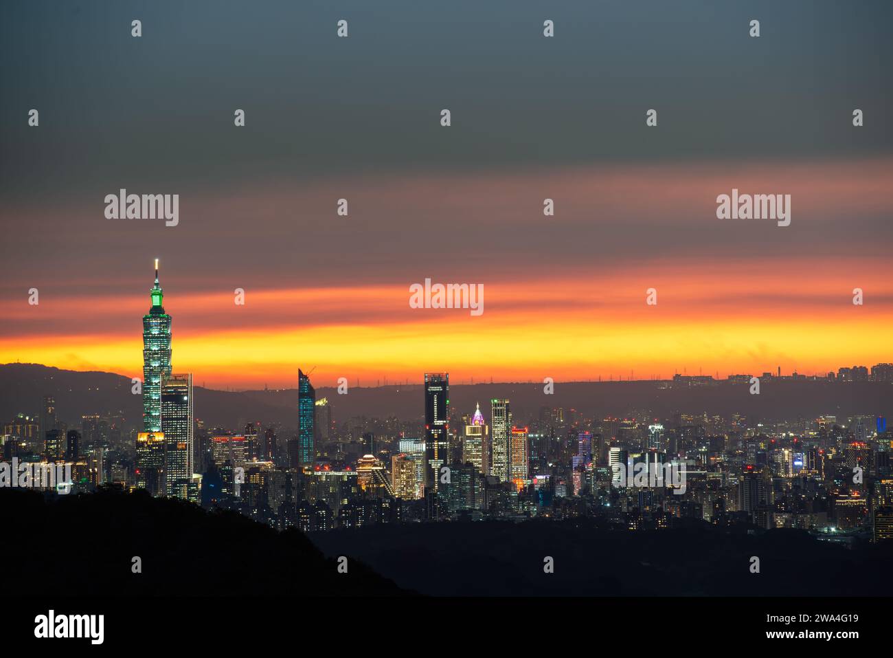 In serene sunset tones, stunning views of the Taipei skyline are ...
