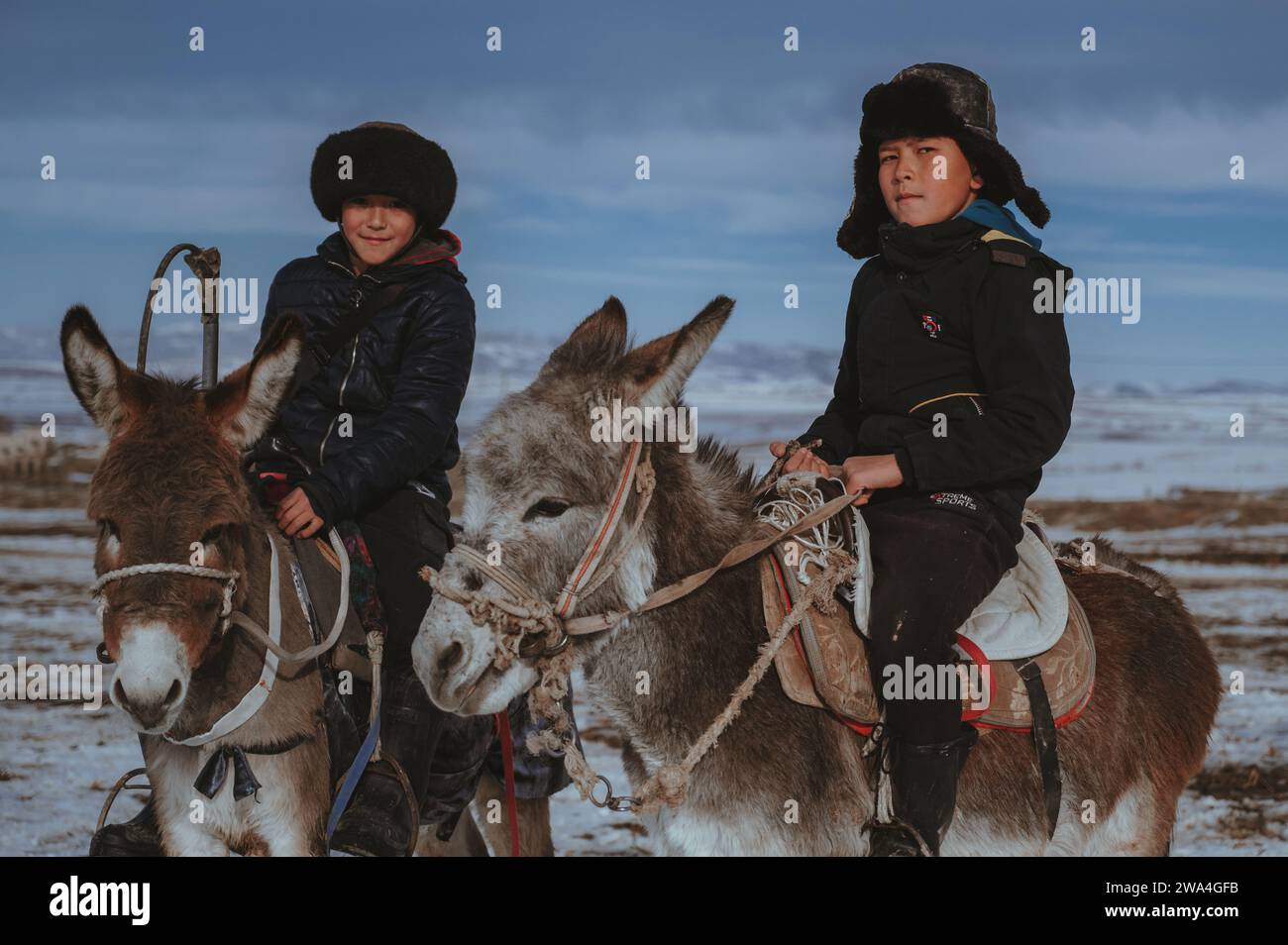 TAU SAMALY, KAZAKHSTAN - DECEMBER 23, 2023: two Kazakh friends boys ...