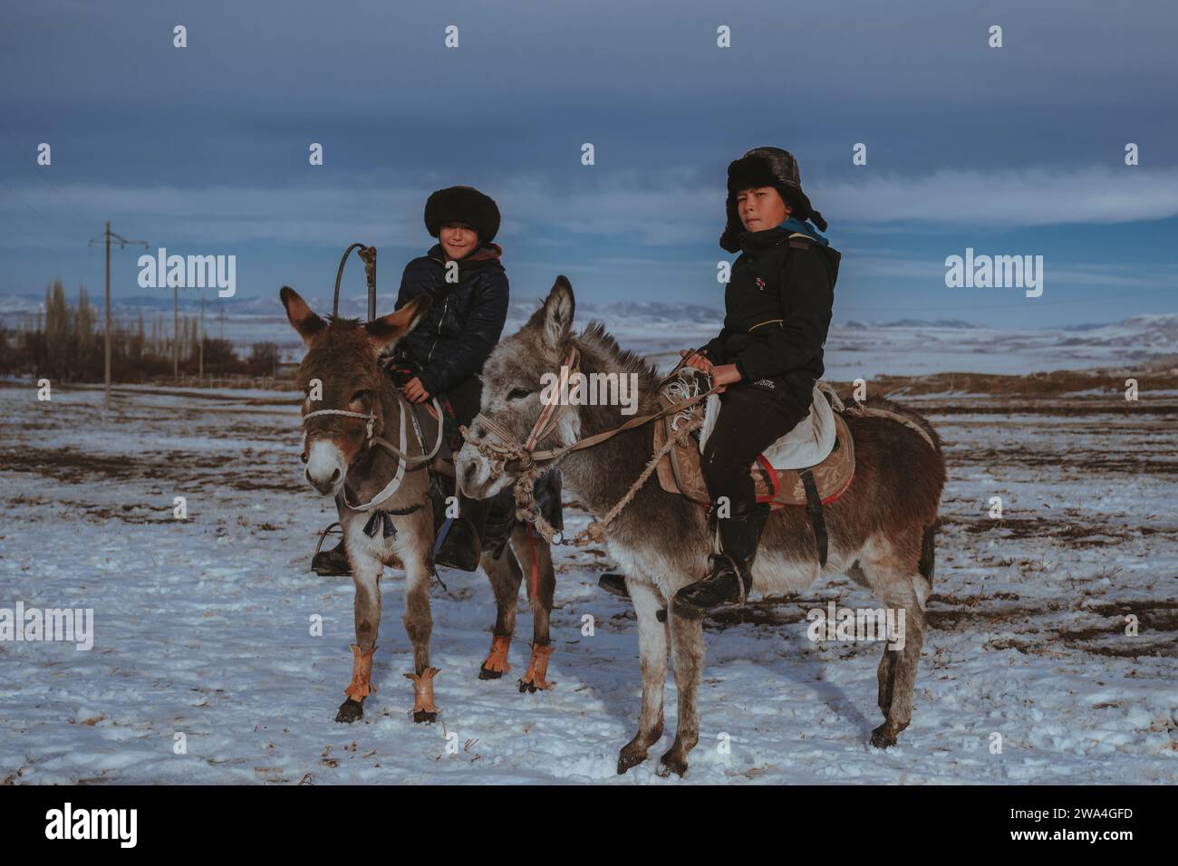 TAU SAMALY, KAZAKHSTAN - DECEMBER 23, 2023: two Kazakh friends boys ...