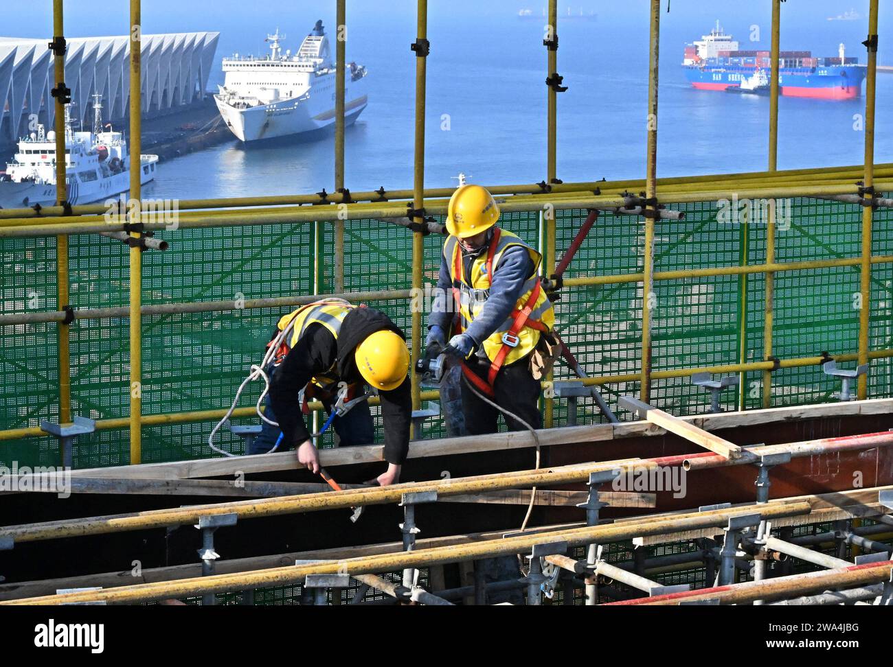 Beijing, China's Shandong Province. 1st Jan, 2024. Constructors work at ...