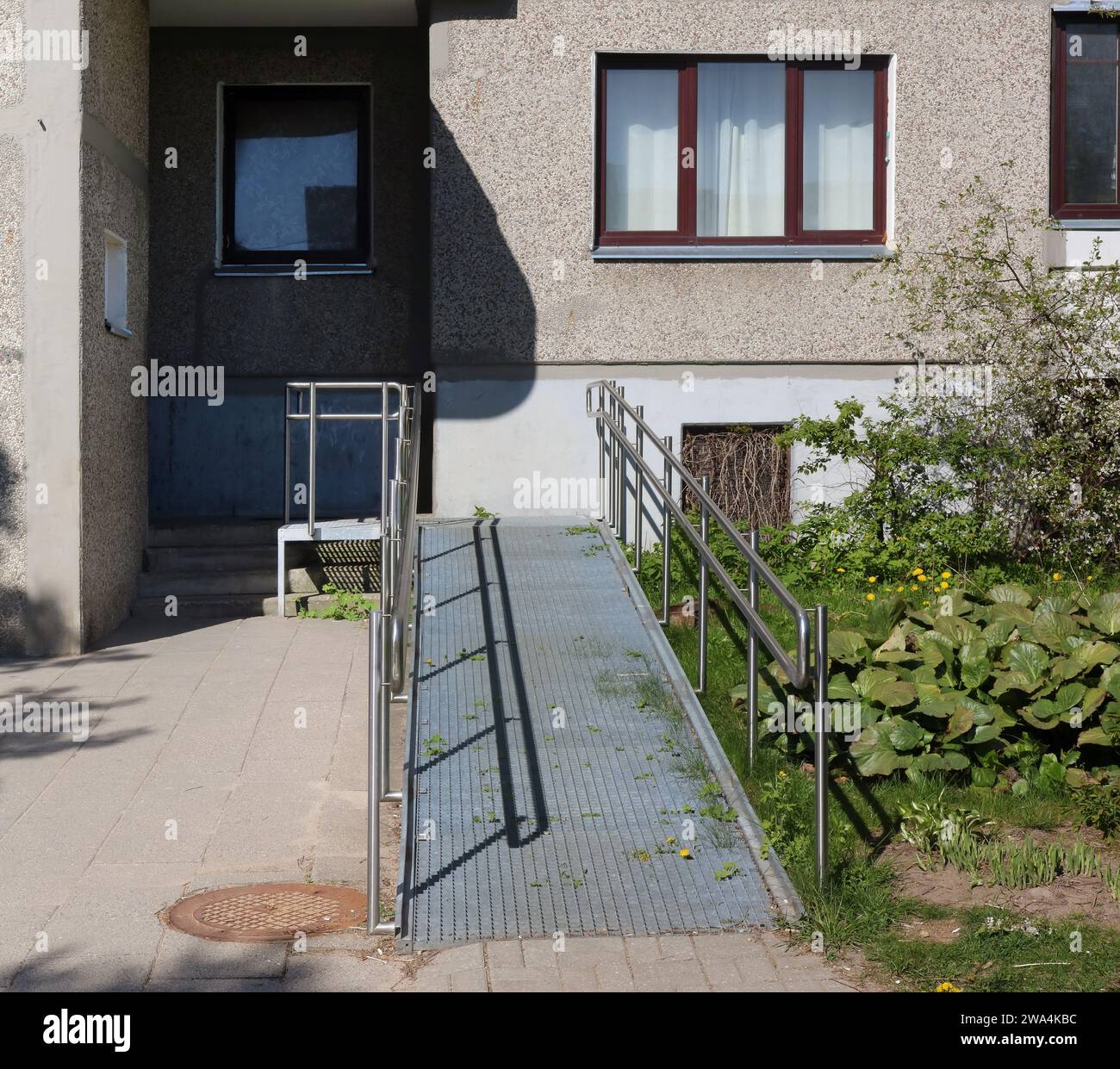 Metal ramp for the disabled near a residential building Stock Photo - Alamy