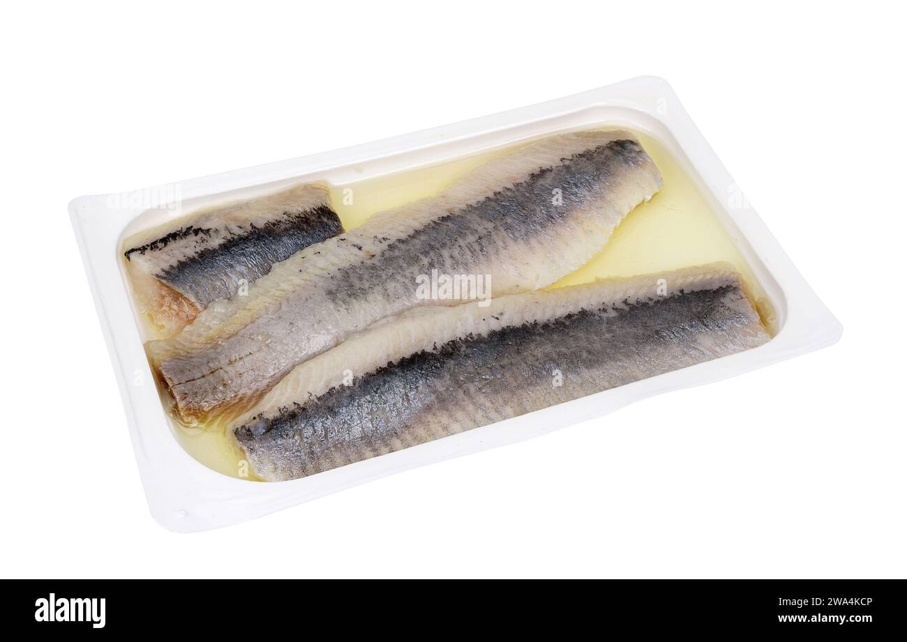 Norwegian herring fillet with vegetable oil isolated on white Stock ...