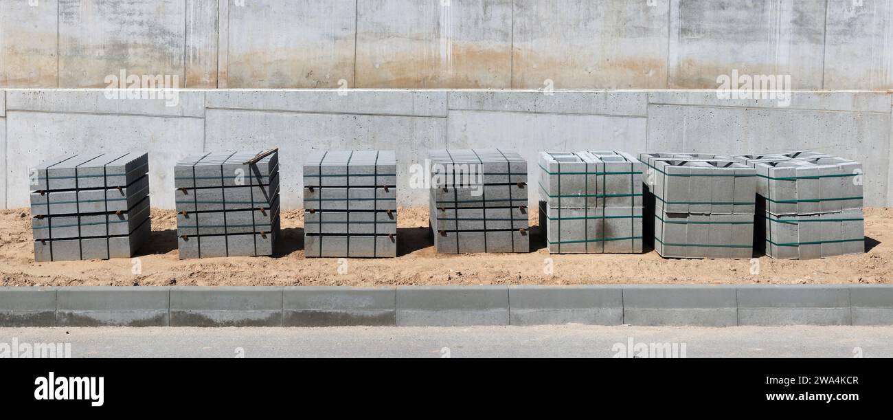Packages of concrete paving slabs at a construction site Stock Photo ...