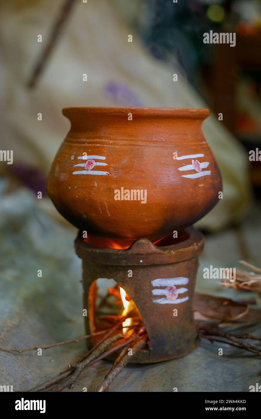 Old pot used for boiling milk in fire wood soil pot. Cultural event in ...