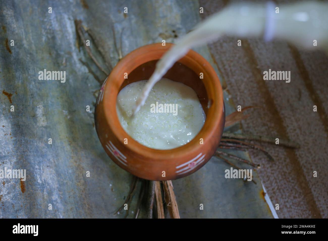 Old pot used for boiling milk in fire wood soil pot. Cultural event in ...