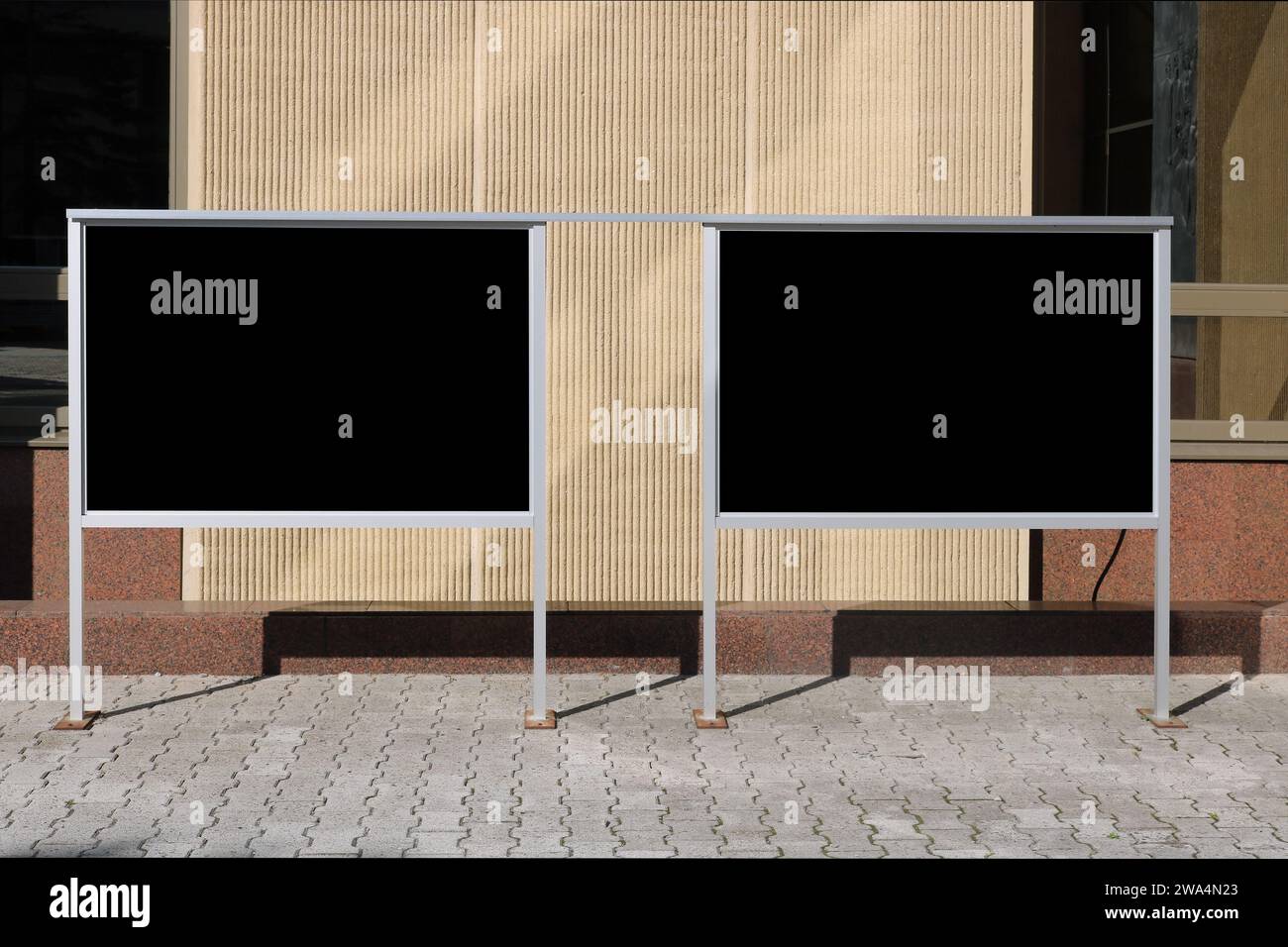 Advertising boards with black isolated surface near administrative ...