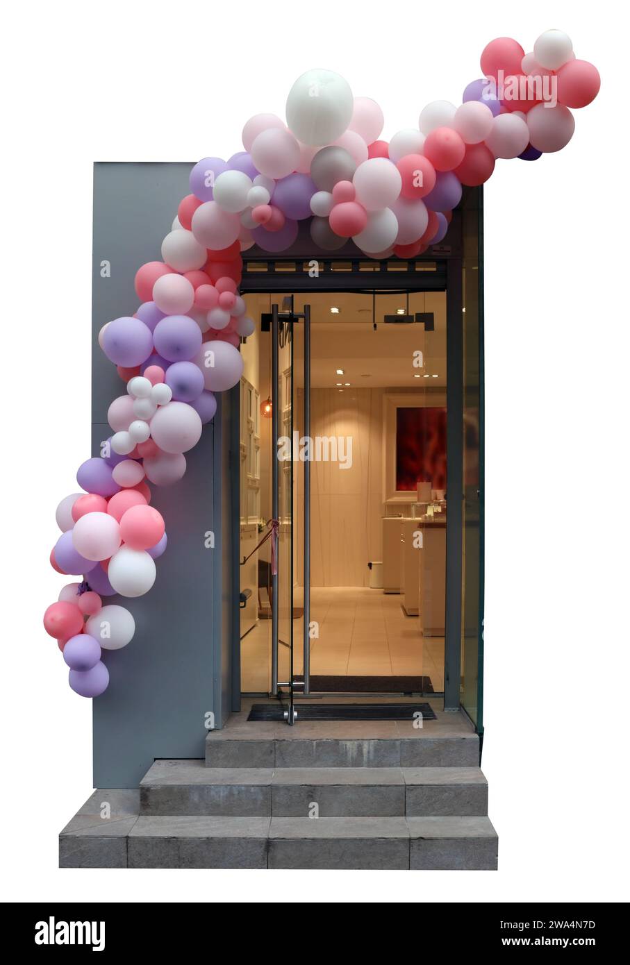 The entrance to the store is decorated with balloons. Isolated in white ...