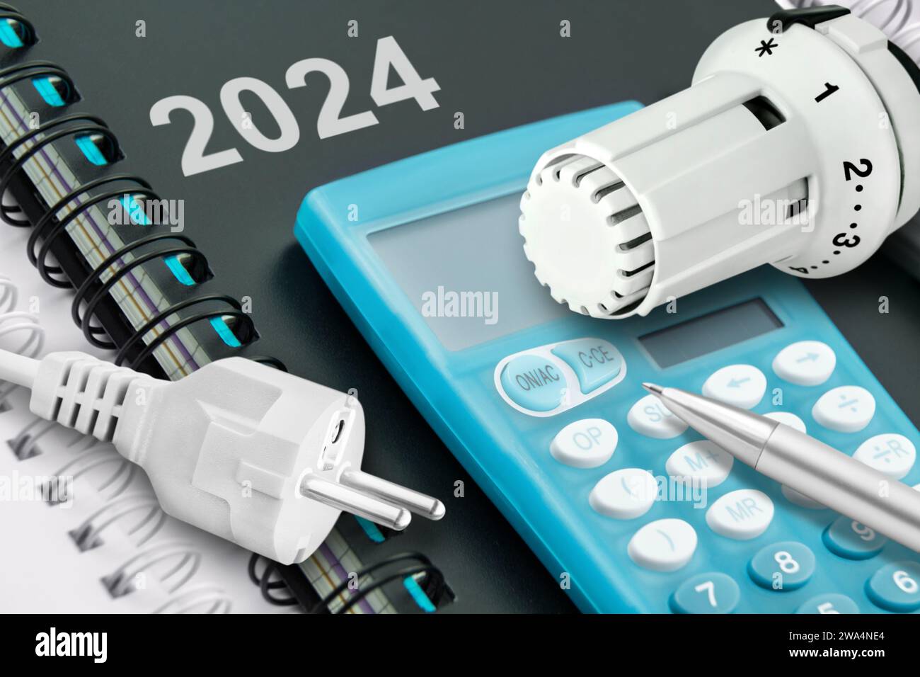 Energy and German calender 2024 power cable and blue calculator with ...