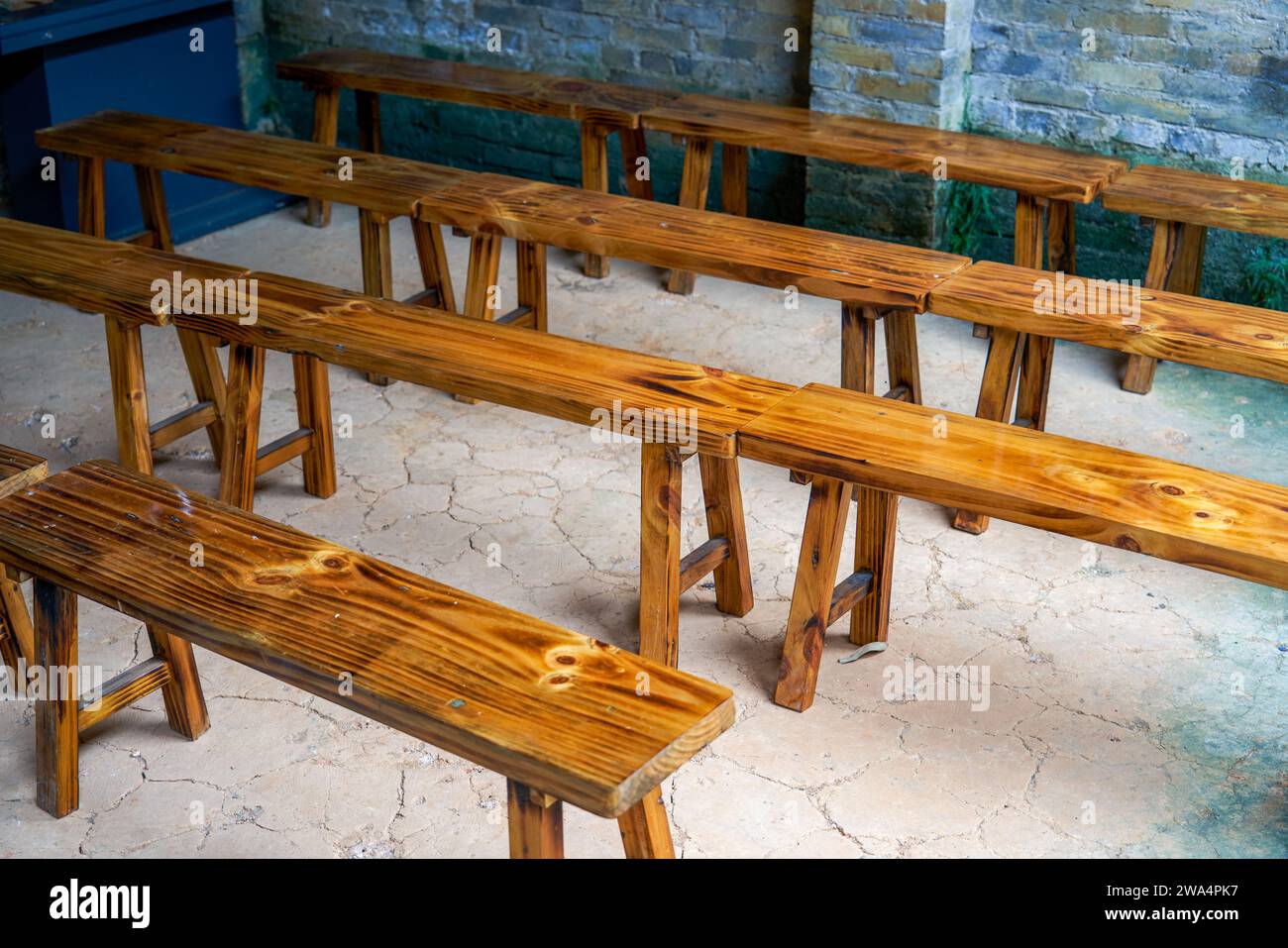 Wooden tables, chairs and benches in conference room in rural China ...