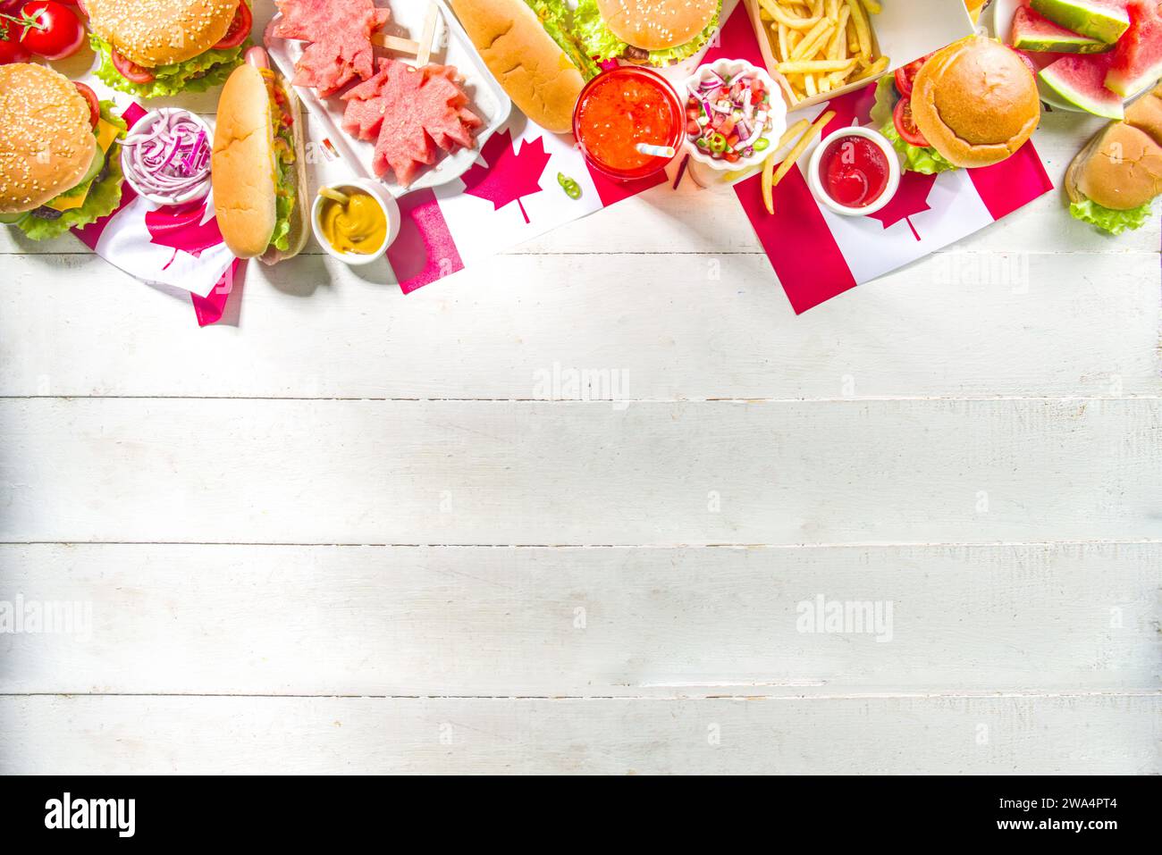 Set of various Canada Day bbq food. Picnic party table with maple leaf ...