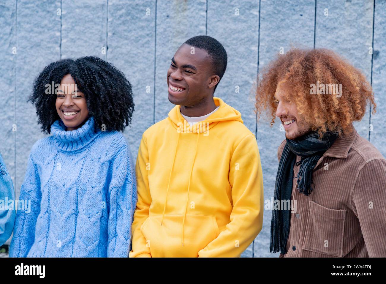 Joyful trio sharing a lighthearted moment, their laughter echoing ...