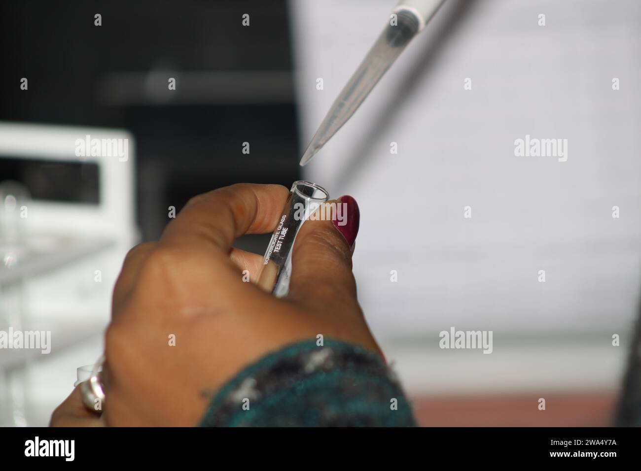 Test Tubes With Liquid Water Samples And Pipette Dropping sample into ...