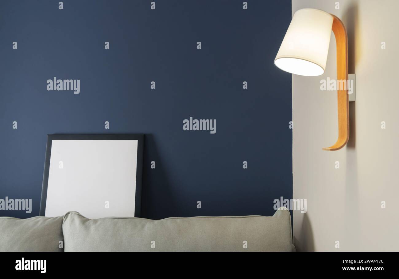 Simple minimalist apartment design with wall lamp, soft couch and empty ...
