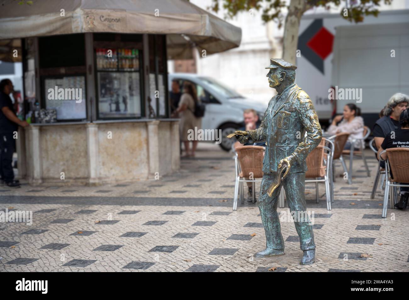 Statue of a lottery ticket seller in Largo Trindade, Coelho, Lisbon ...