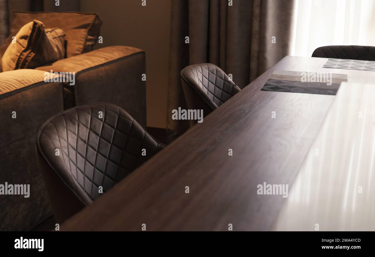 Large wooden dining table with soft chairs. Kitchen interior Stock ...