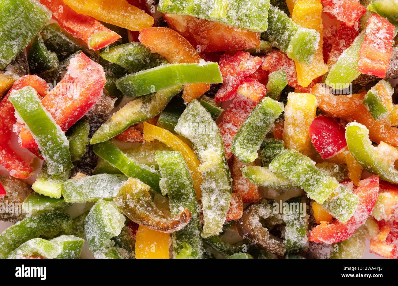 Frozen sliced bell pepper covered with ice. Frozen vegetables ...