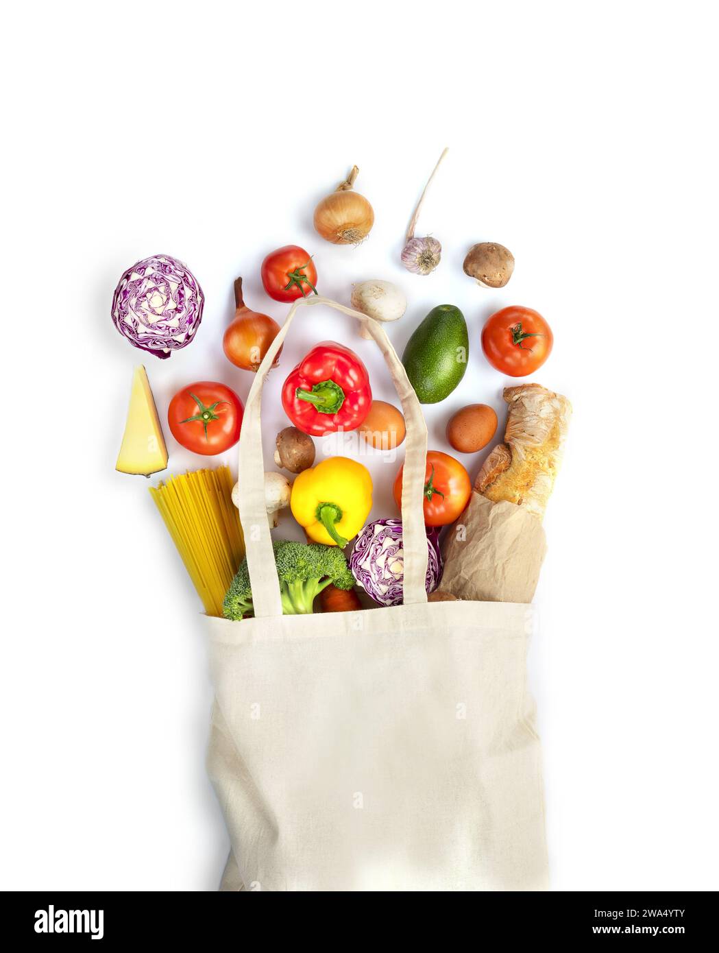 Eco friendly fabric bag filled with fresh colorful vegetables, pasta ...