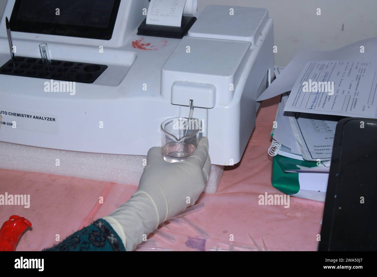 A Semi Auto Chemistry Analyzer drawing water from a glass pipe.India ...