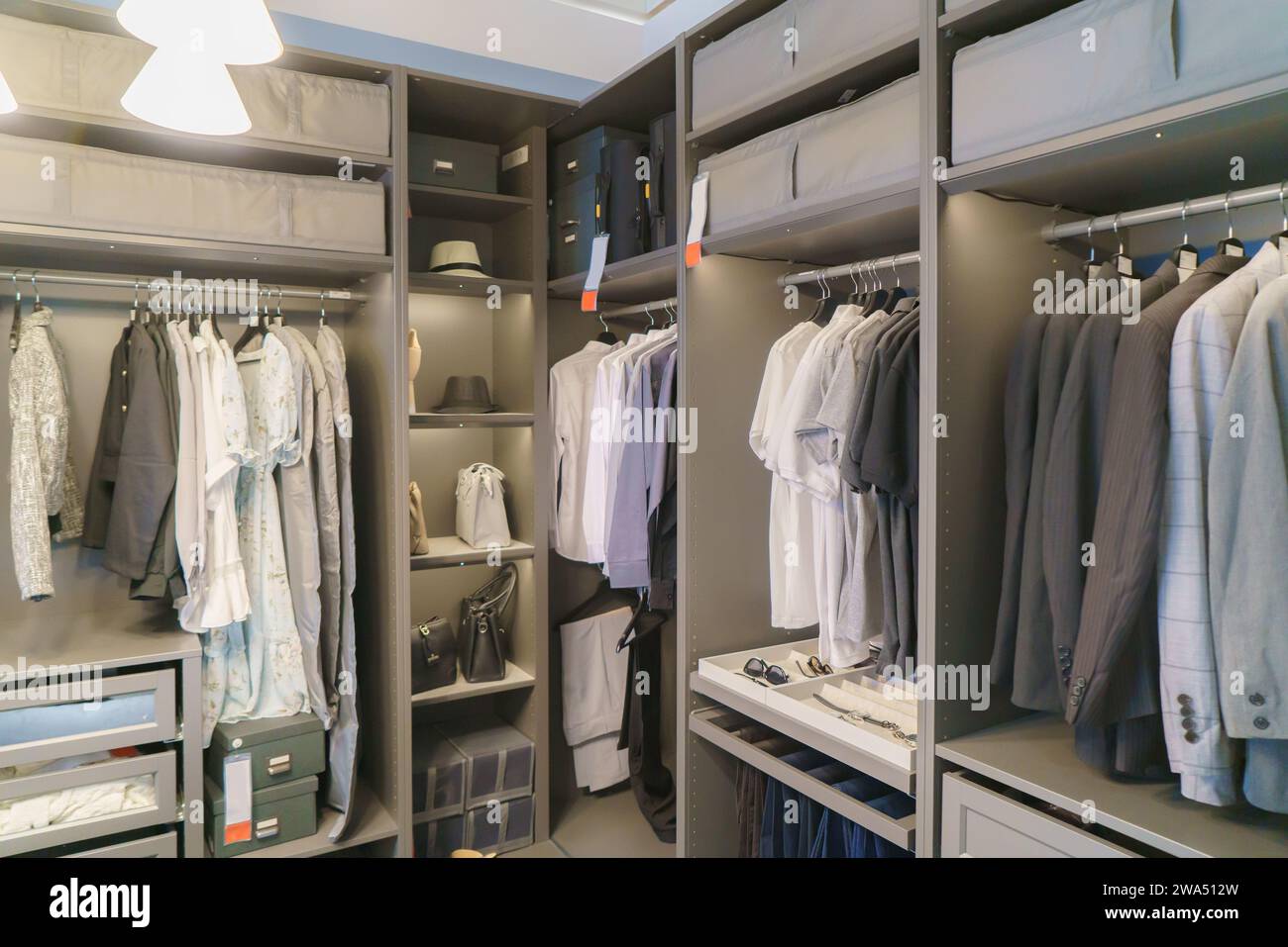 Minimal wood walk-in closet adorned with a stylish wardrobe essence of ...