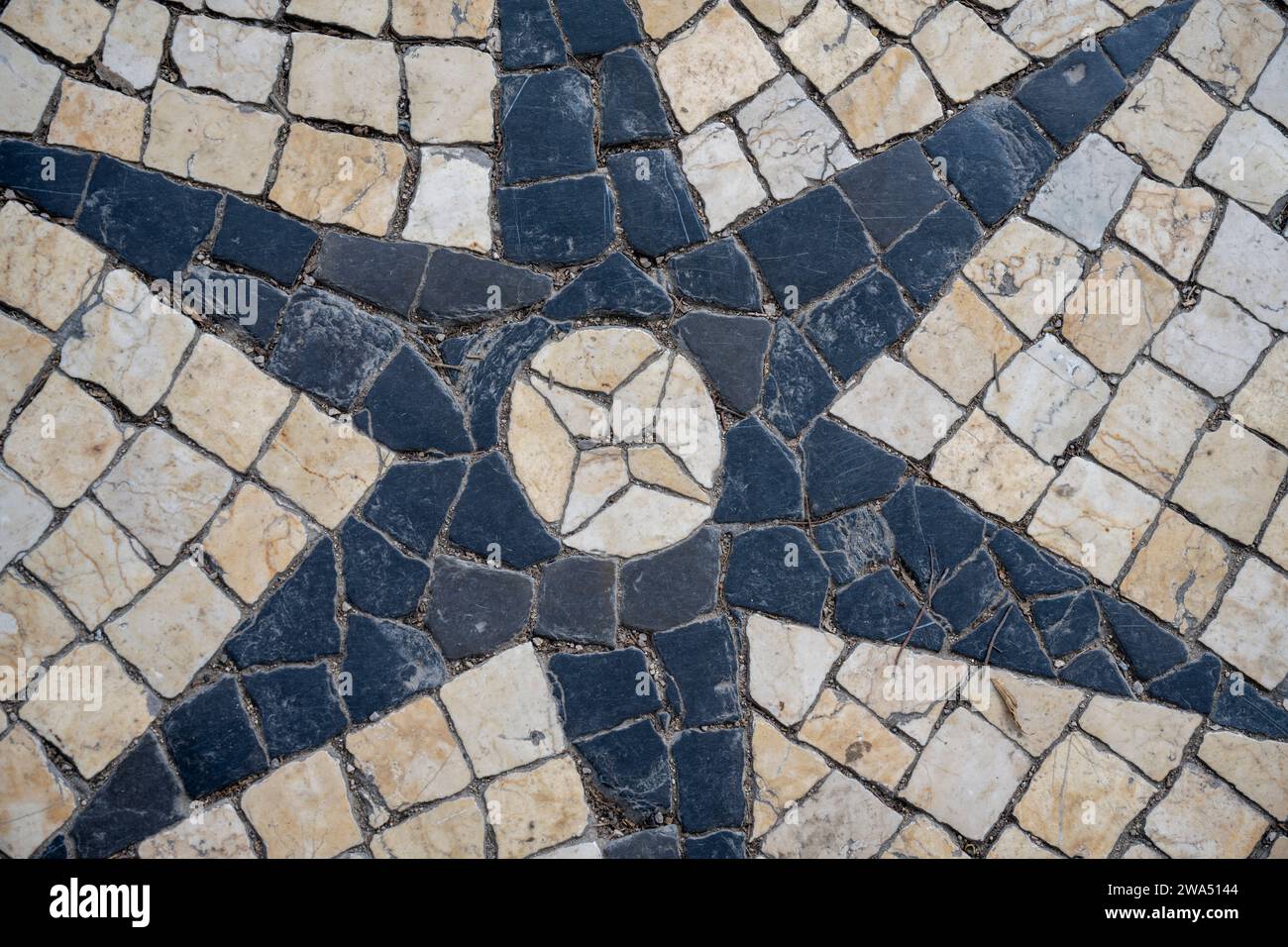 Elaborate design in black and white stones on the pavement at Miradouro ...