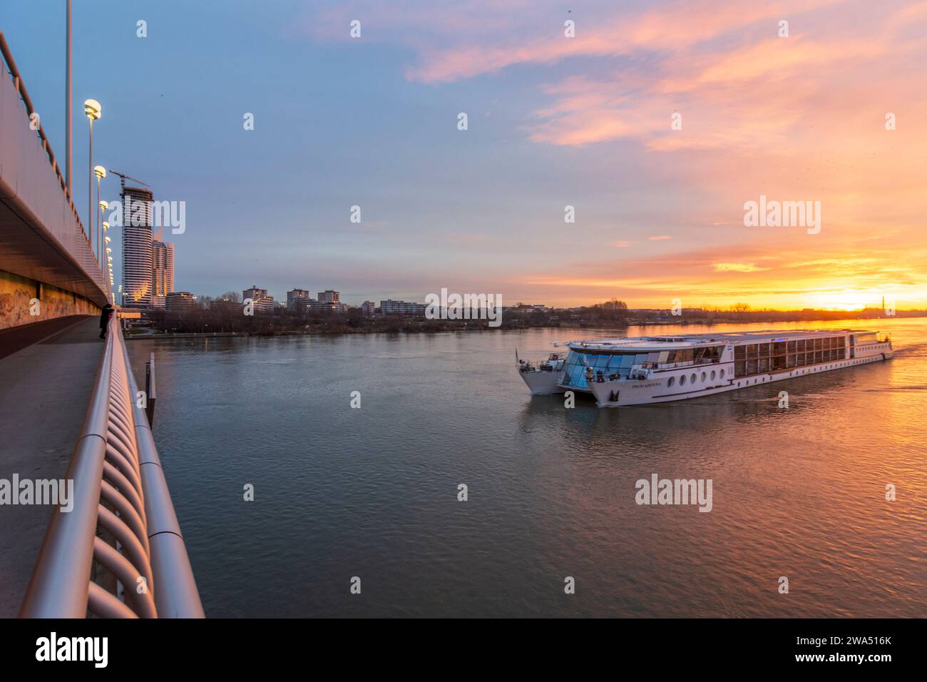 Vienna: river Donau (Danube) at sunrise, cruise ship, bridge ...