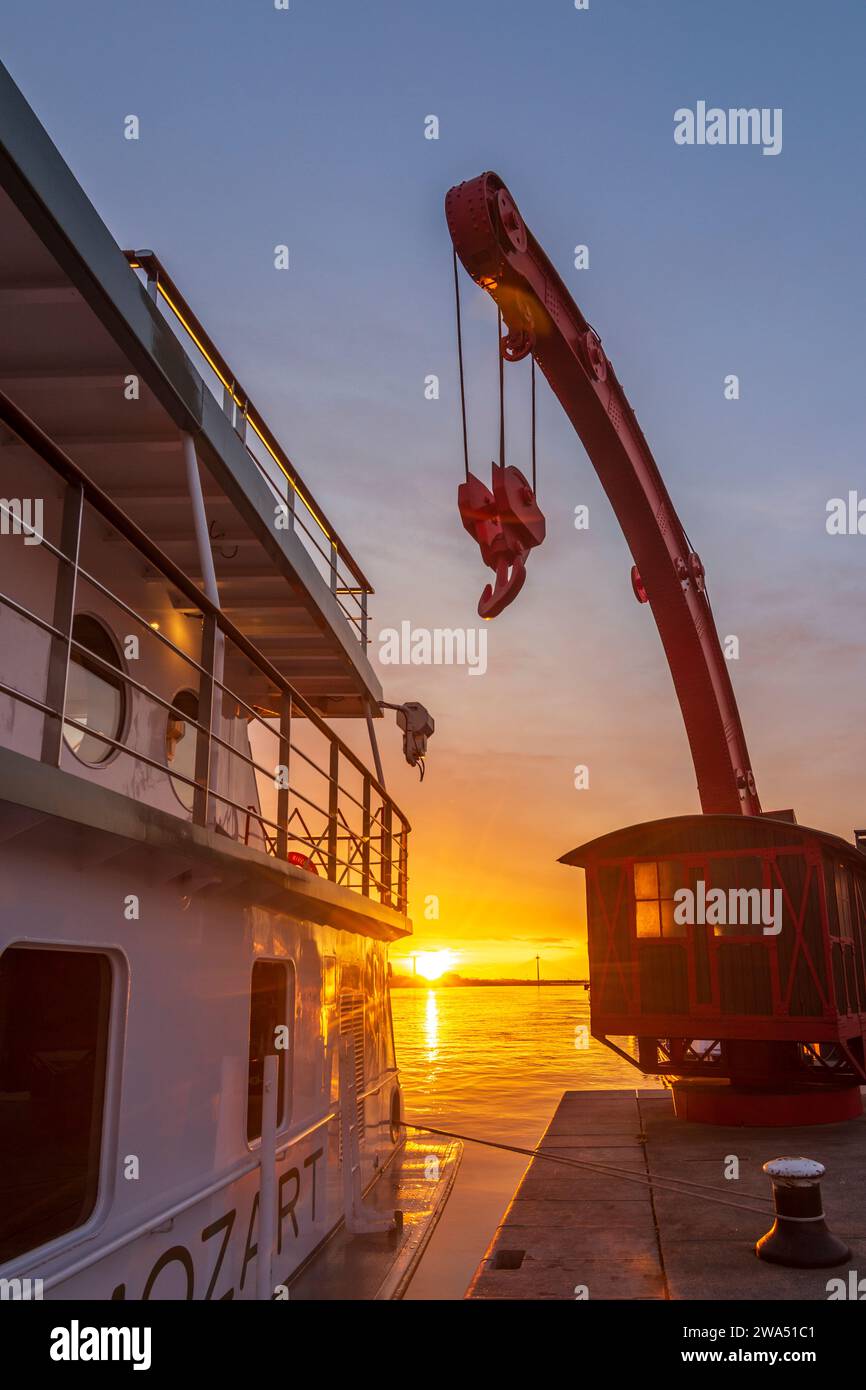 Vienna: river Donau (Danube) at sunrise, cruise ship at jetty, old port ...