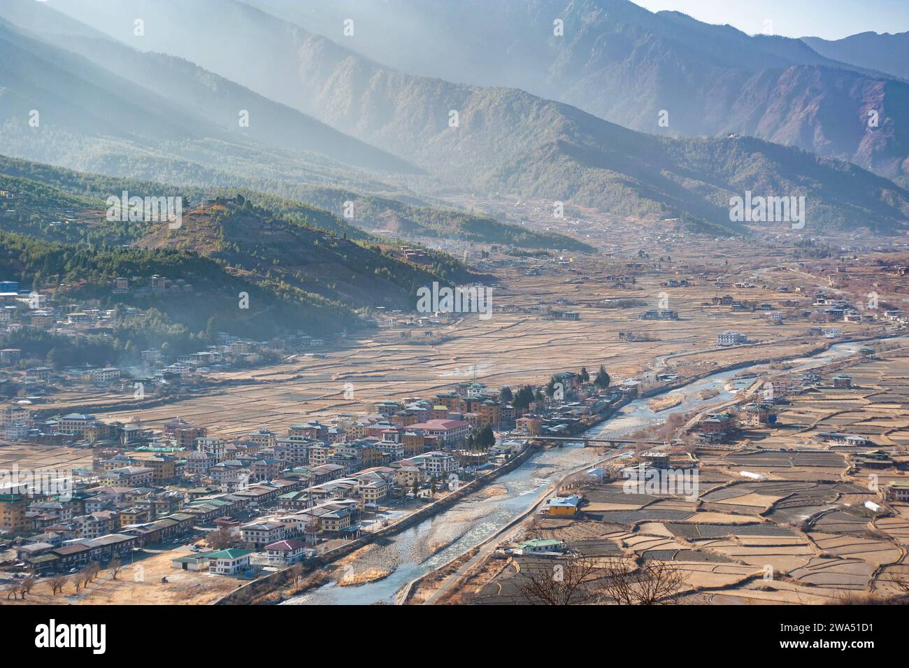 A view of the city of Paro and the surrounding valleys and mountains in ...