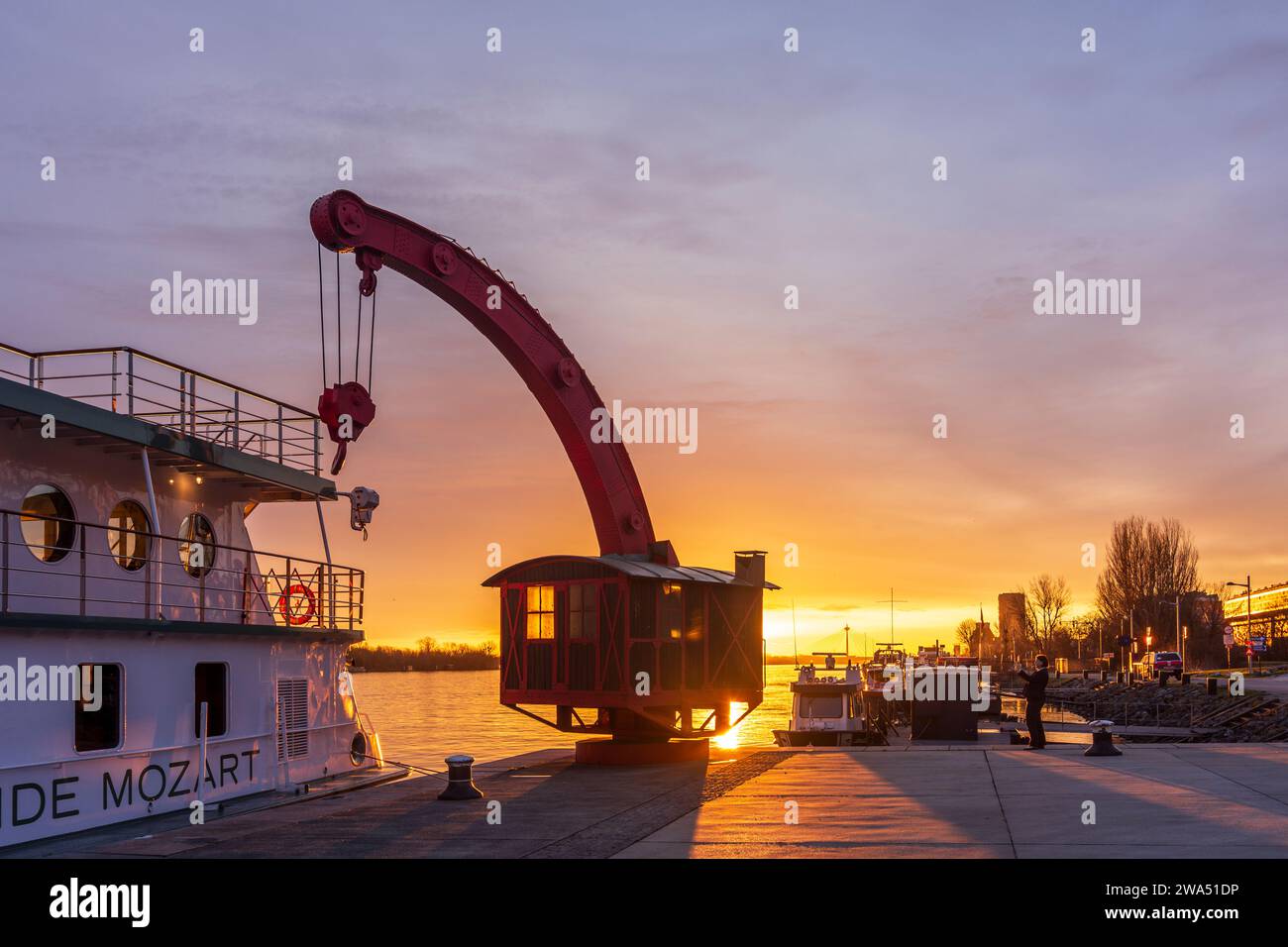 Vienna: river Donau (Danube) at sunrise, cruise ship at jetty, old port ...