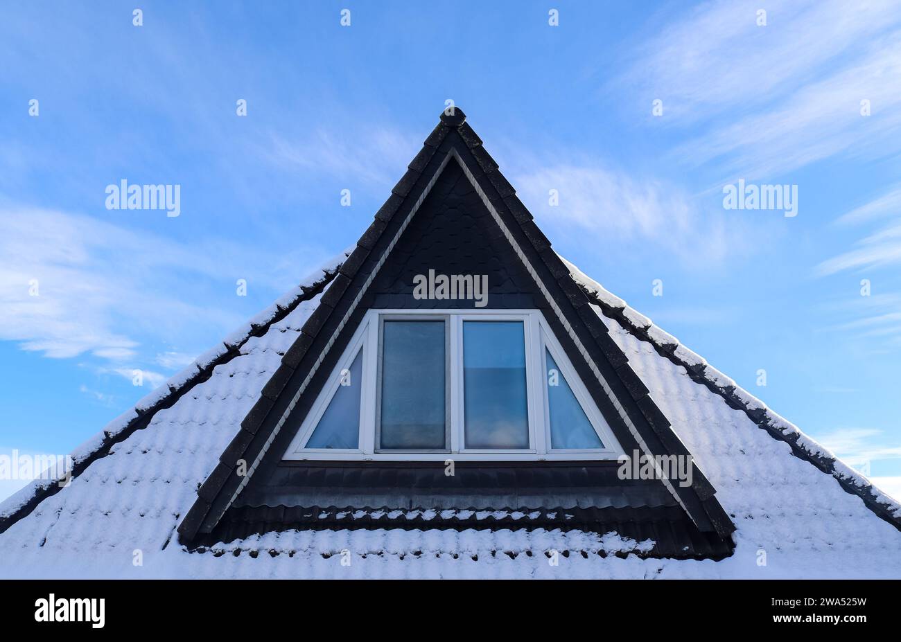 Roof window in velux style with black roof tiles Stock Photo - Alamy