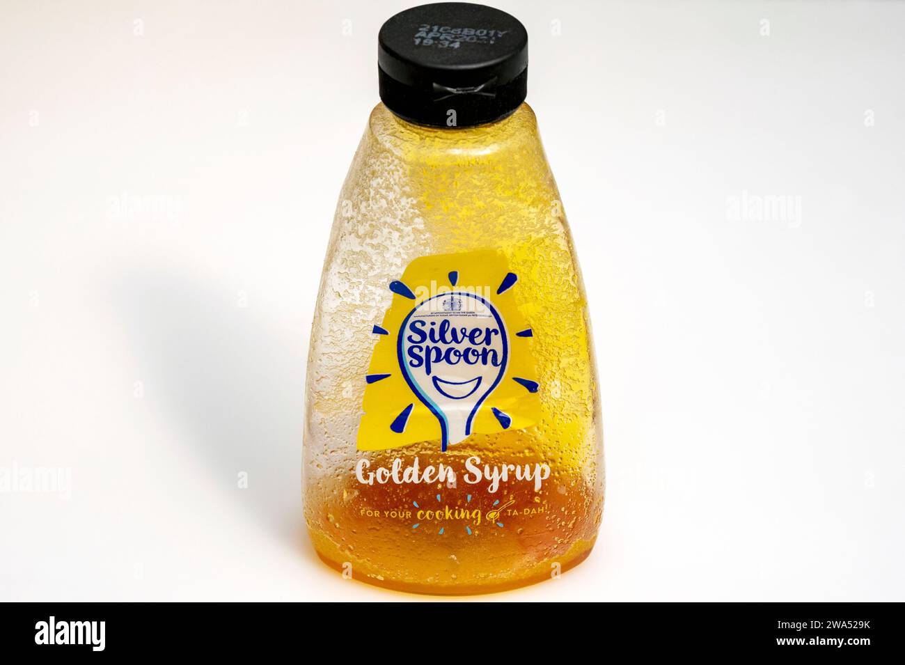 Sliver Spoon golden syrup Stock Photo - Alamy