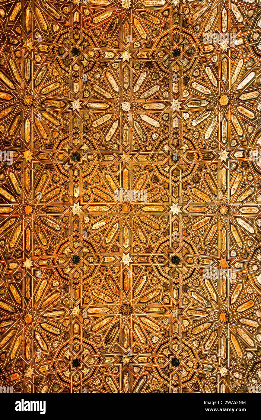 Floral decorative pattern in an ancient wall in Alhambra, Spain. The ...