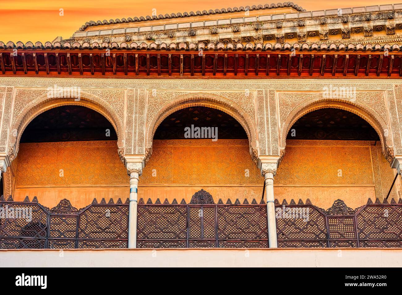 Arches and columns in the walls of a courtyard, Alhambra, Spain. The ...