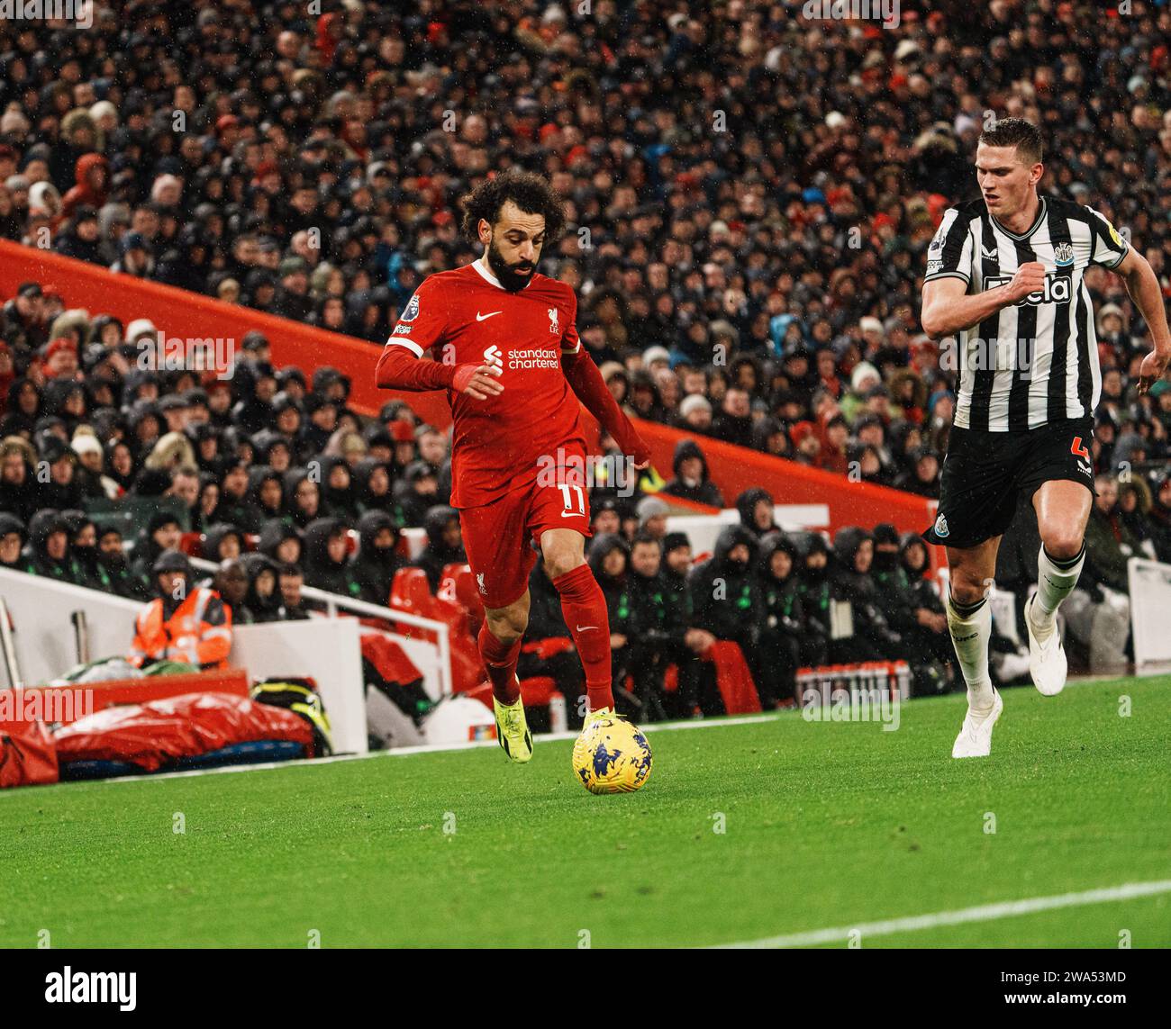 LIVERPOOL, ENGLAND - JANUARY 01: Mohamed Salah of Liverpool takes on ...