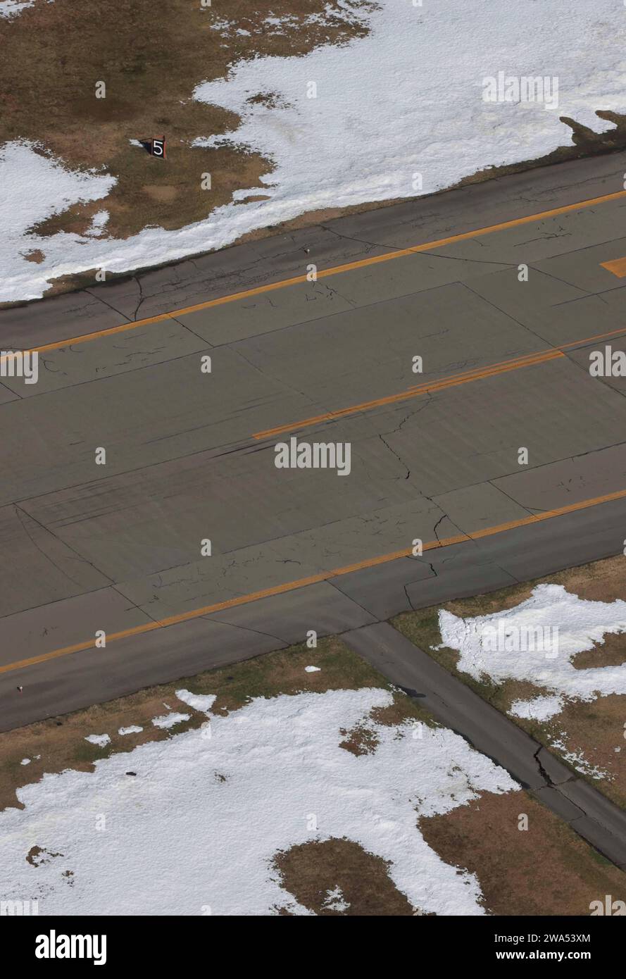 An aerial photo shows the runway of Noto Airport damaged by a massive ...