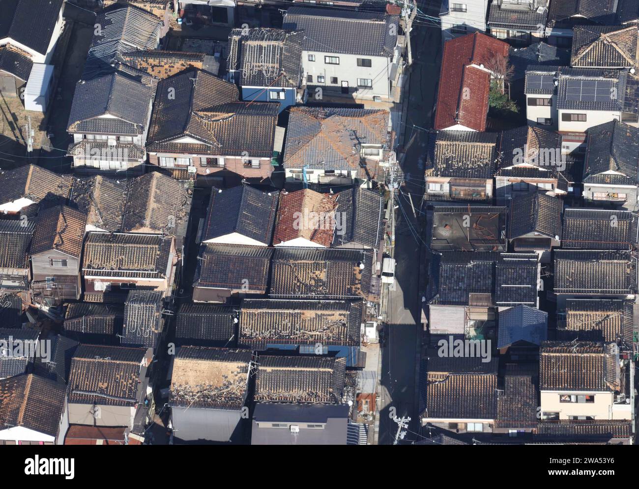 An aerial photo shows roof tiles collapsed by a powerful earthquake in ...