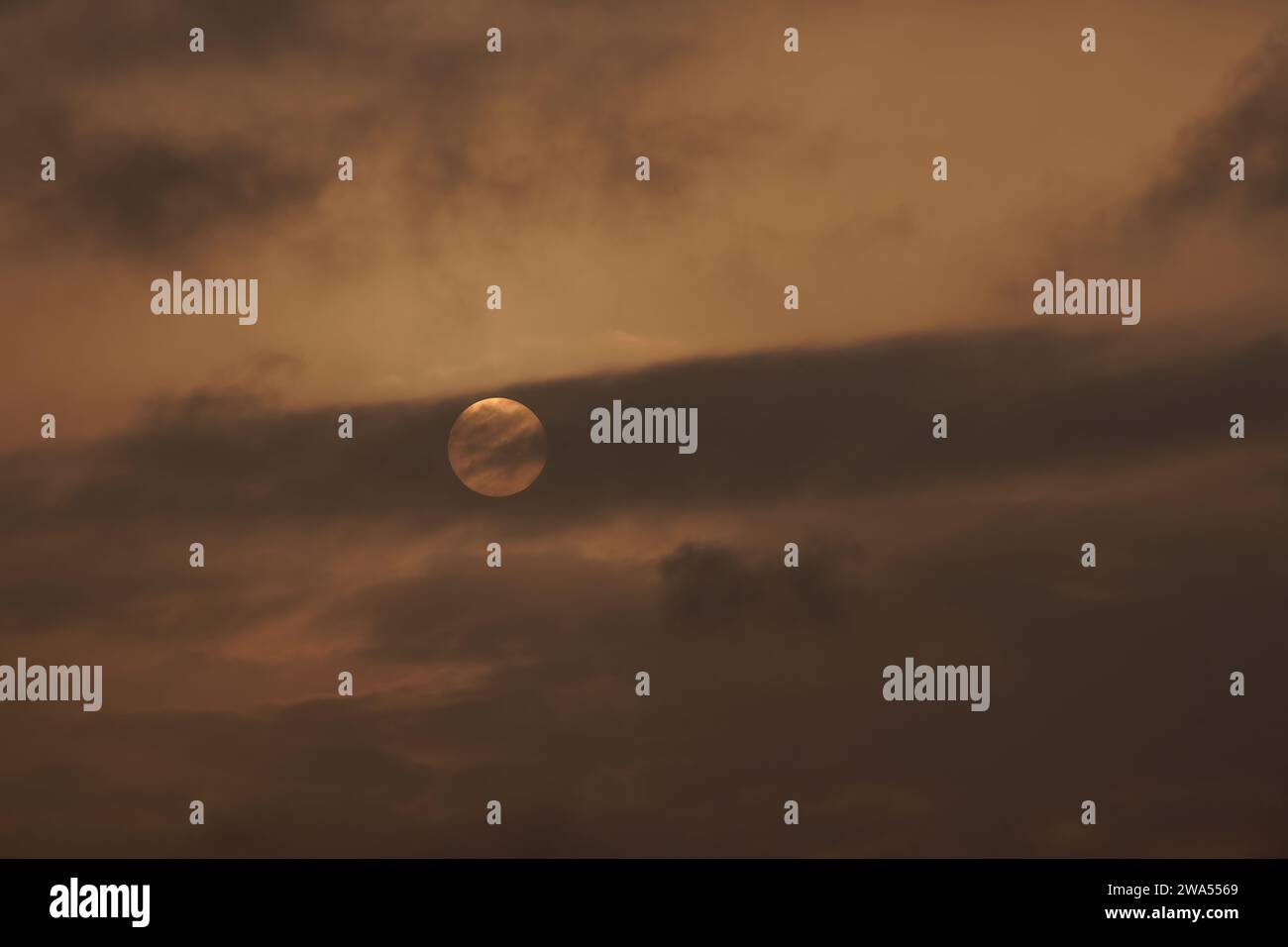 Sky, with diffused sun clouds colourful Stock Photo - Alamy