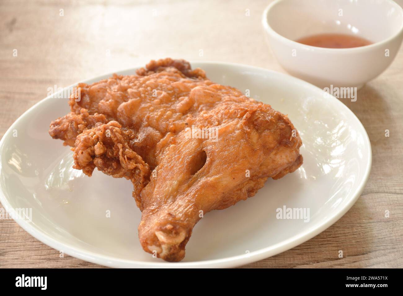 crispy fried chicken tight and leg on plate dipping sweet chili sauce ...