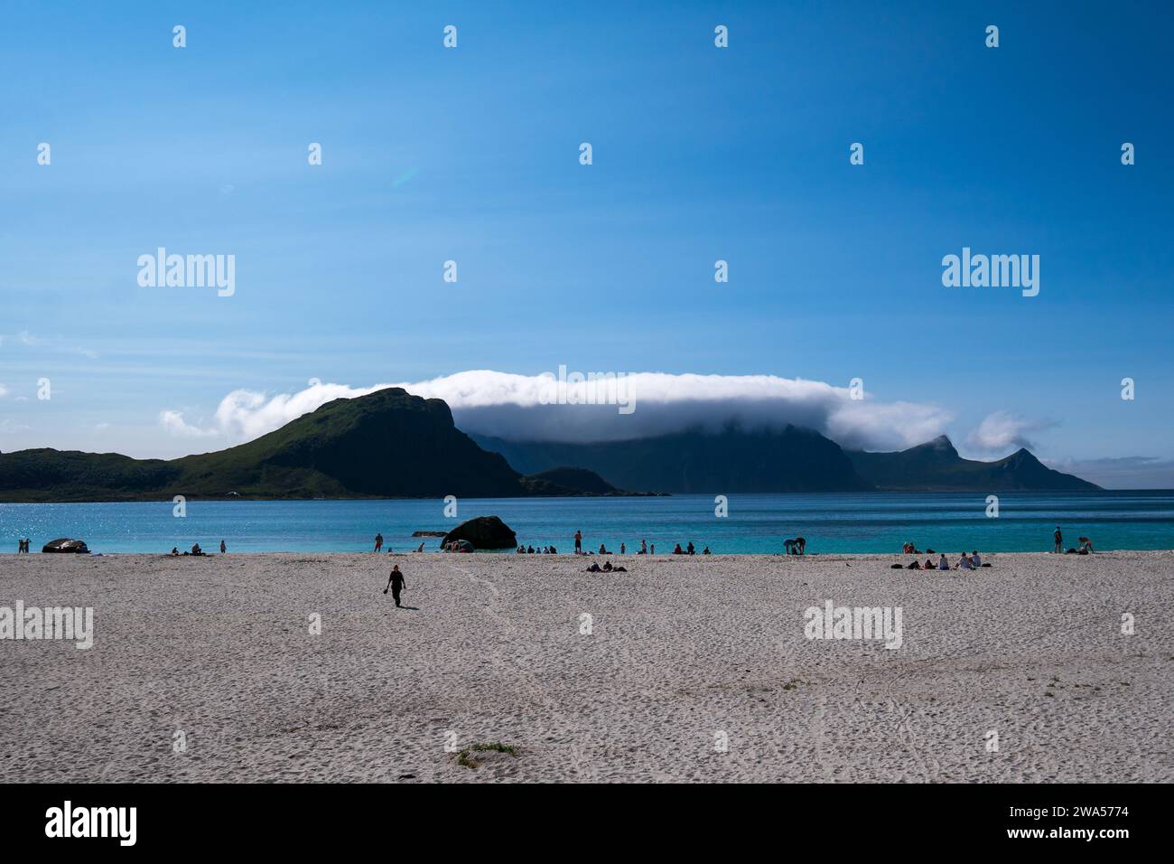 The beach of Hauklandstranda in Lofoten, northern Norway, with people ...