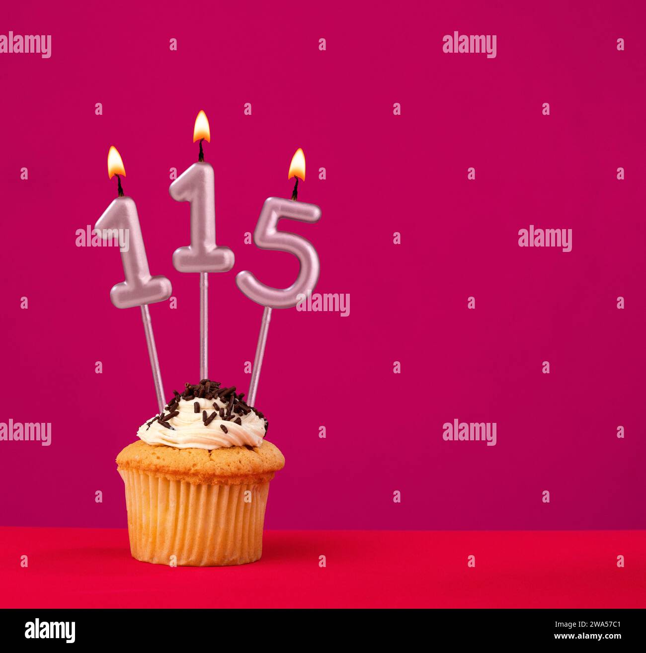 Birthday cake with candle number 115 - Rhodamine Red foamy background ...