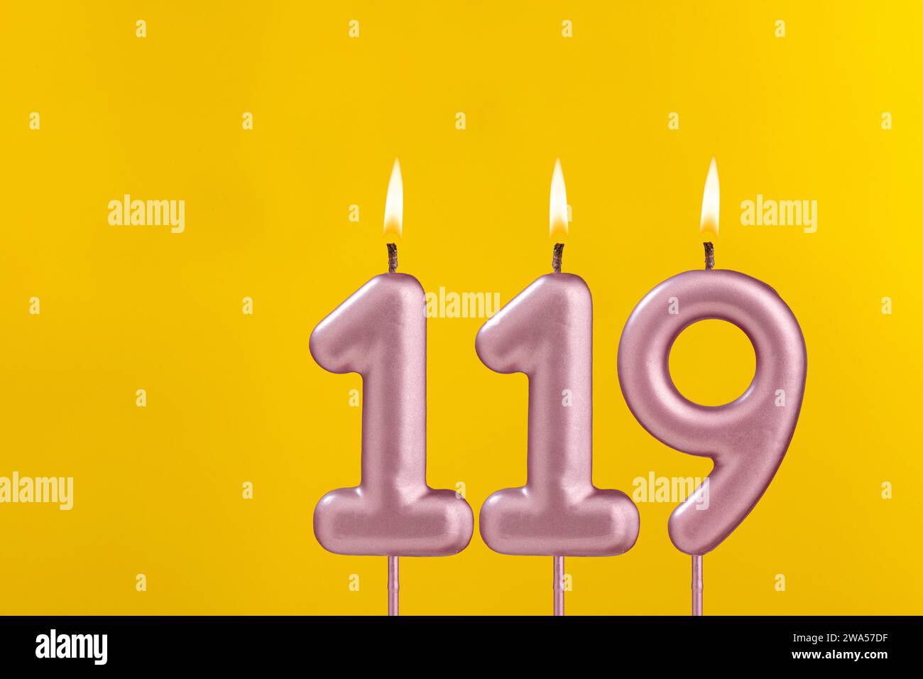 Birthday candle number 119 - Birthday celebration on yellow background ...