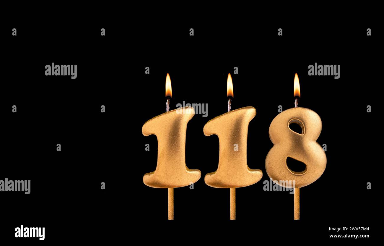 Birthday candle number 118 - Birthday celebration on black background ...